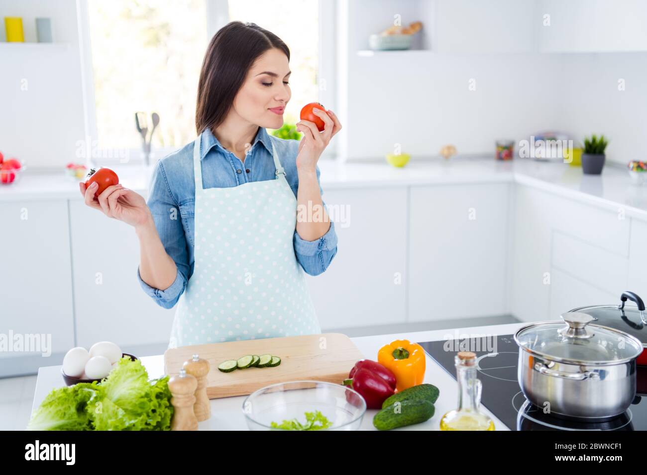 Portrait of her she nice attractive pretty cheerful dreamy girl cooking ...