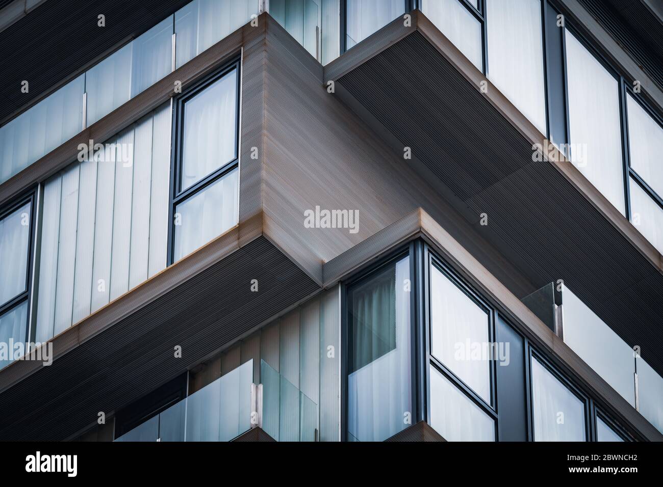 Architecture detail of the glass balconies of a minimalist urban ...
