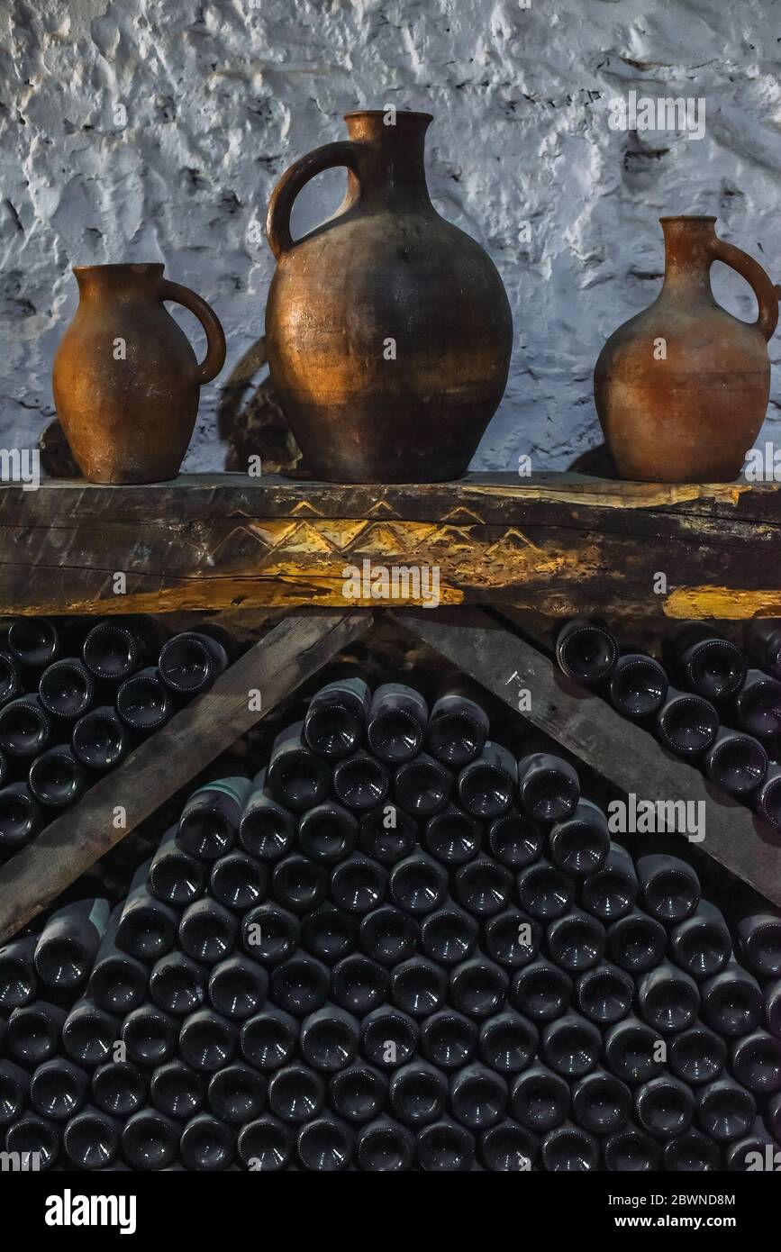 Old, ancient wine collection and dusty wine bottles in an underground ...