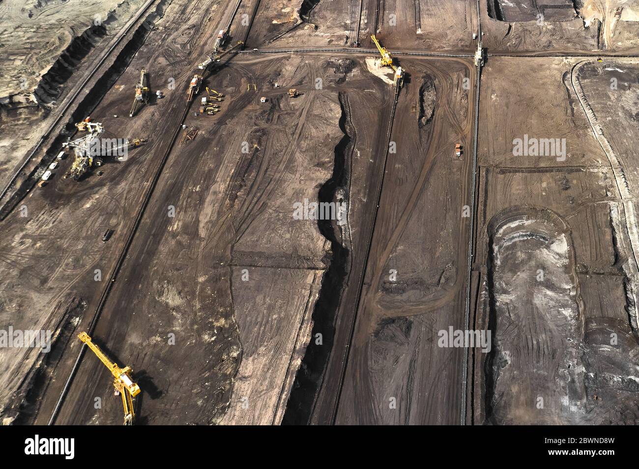Aerial shoot of quarry with heavy bucket wheel excavators mining a coal ...