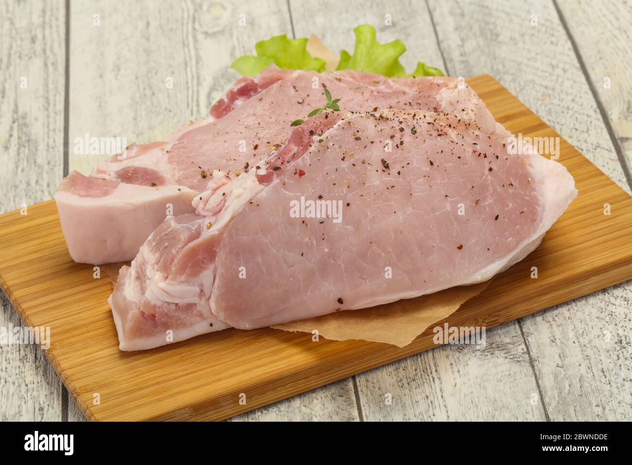 Raw pork meat steak ready for grill Stock Photo - Alamy