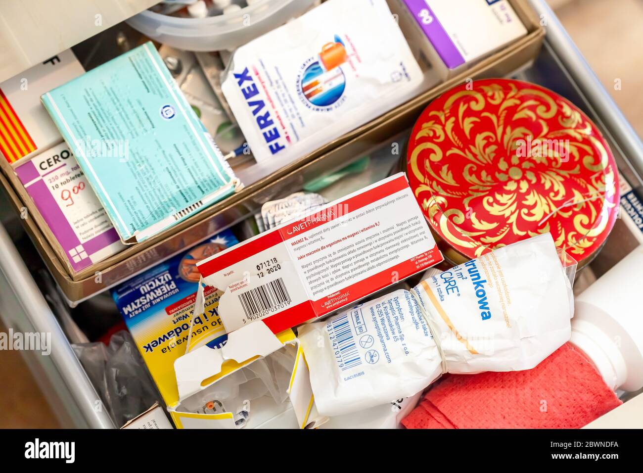 Household medicine drawer full of medication storage closeup, top view ...