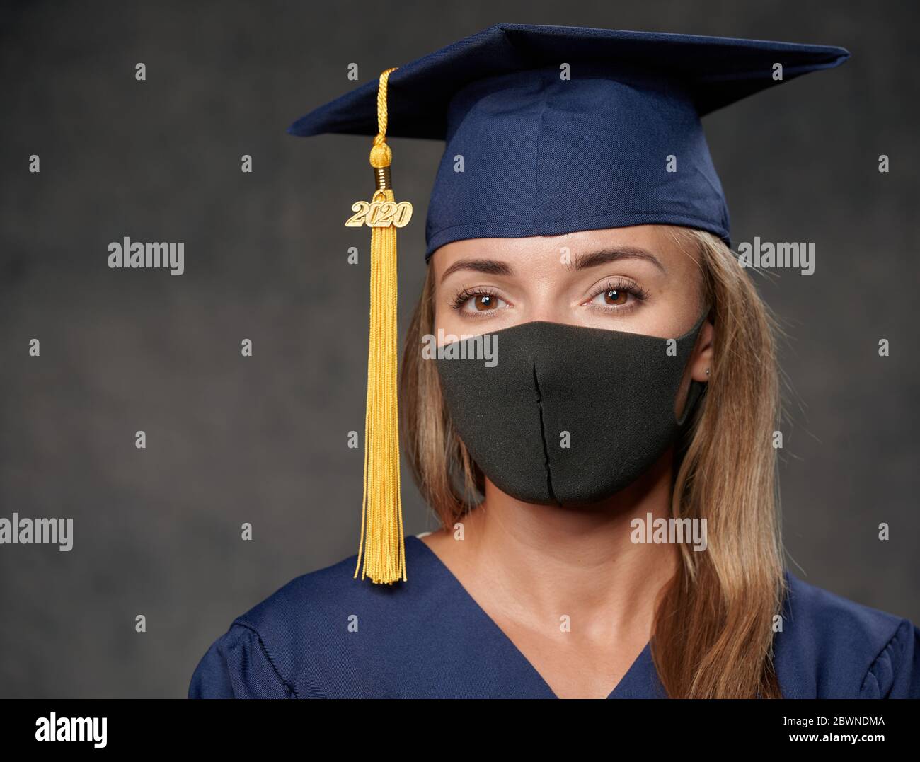 Young woman graduate in black mask celebrating her university degree ...