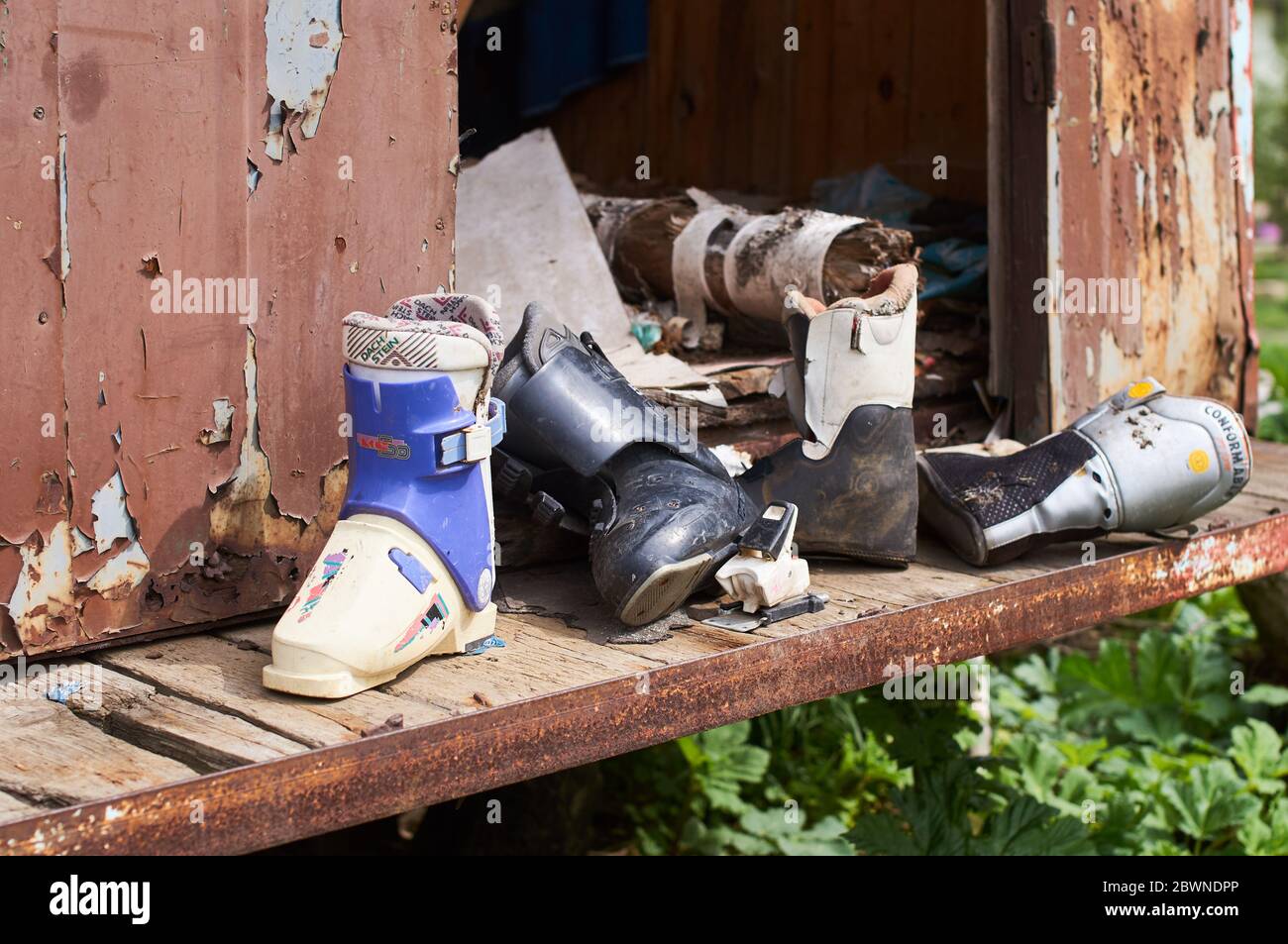 Old broken ski boots in rusty cabin Stock Photo - Alamy