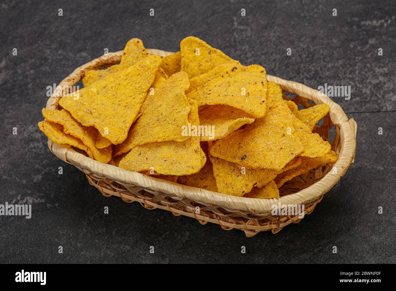 Mexican crunchy corn nachos triangle heap Stock Photo - Alamy