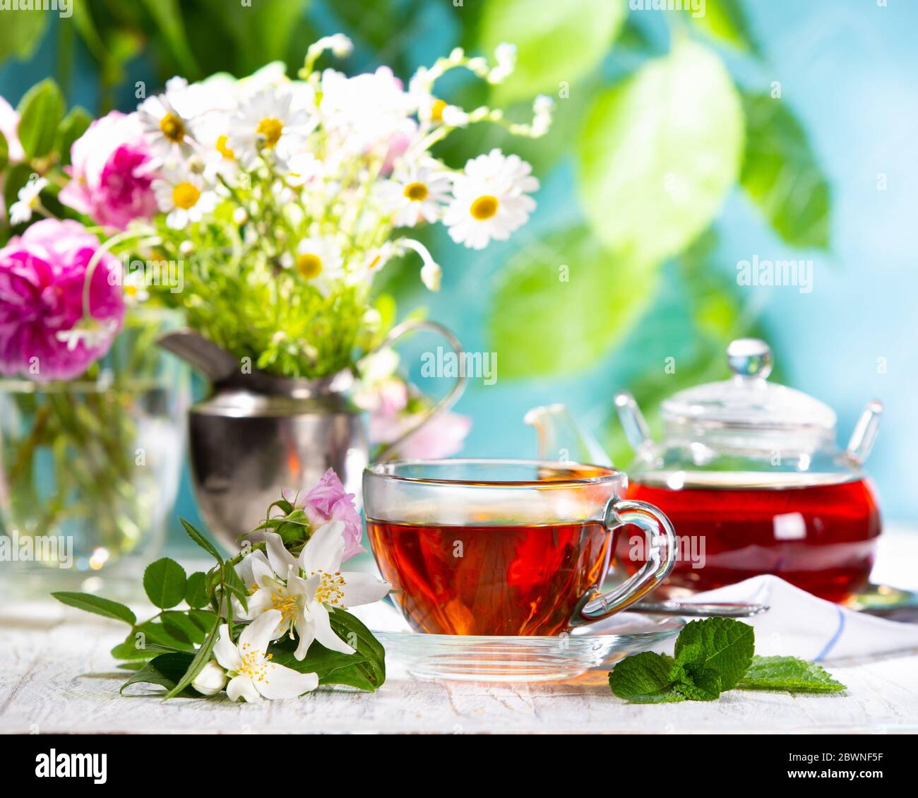 Cup of tea and field of flowers on a sunny day Stock Photo - Alamy