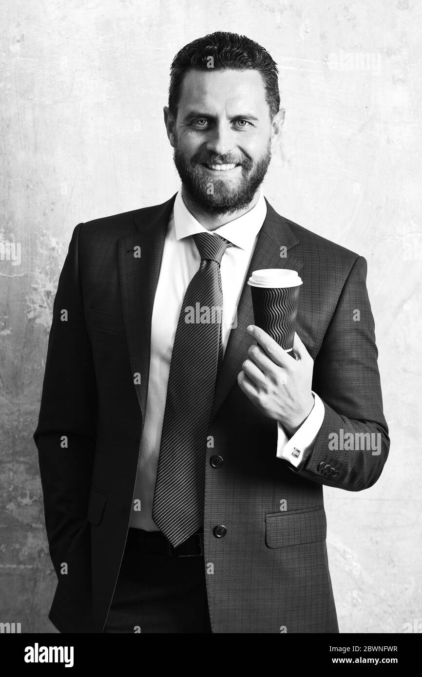 happy man in blue suit with coffee or tea cup, business and success ...