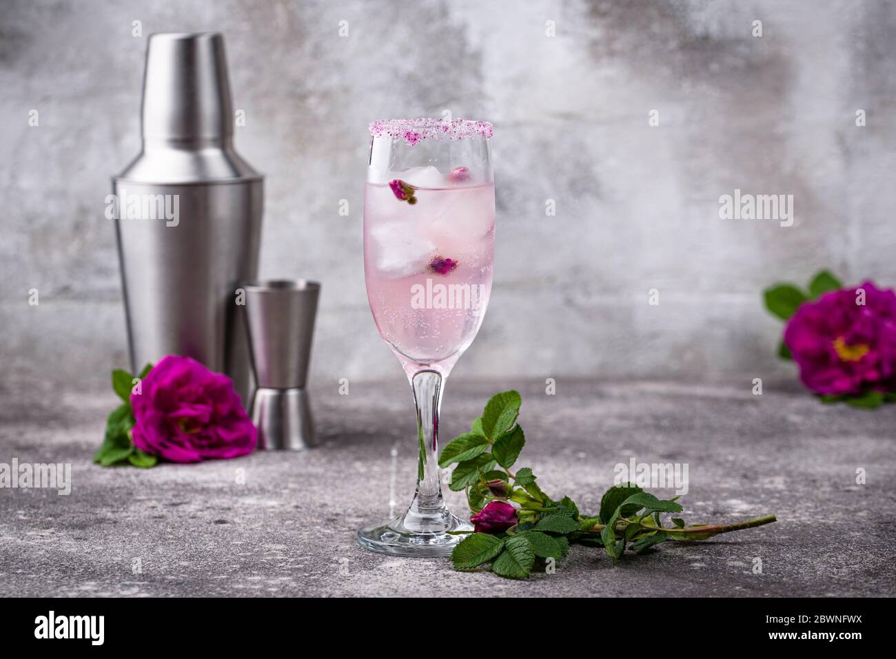 Pink cocktail with champagne and rose syrup Stock Photo - Alamy