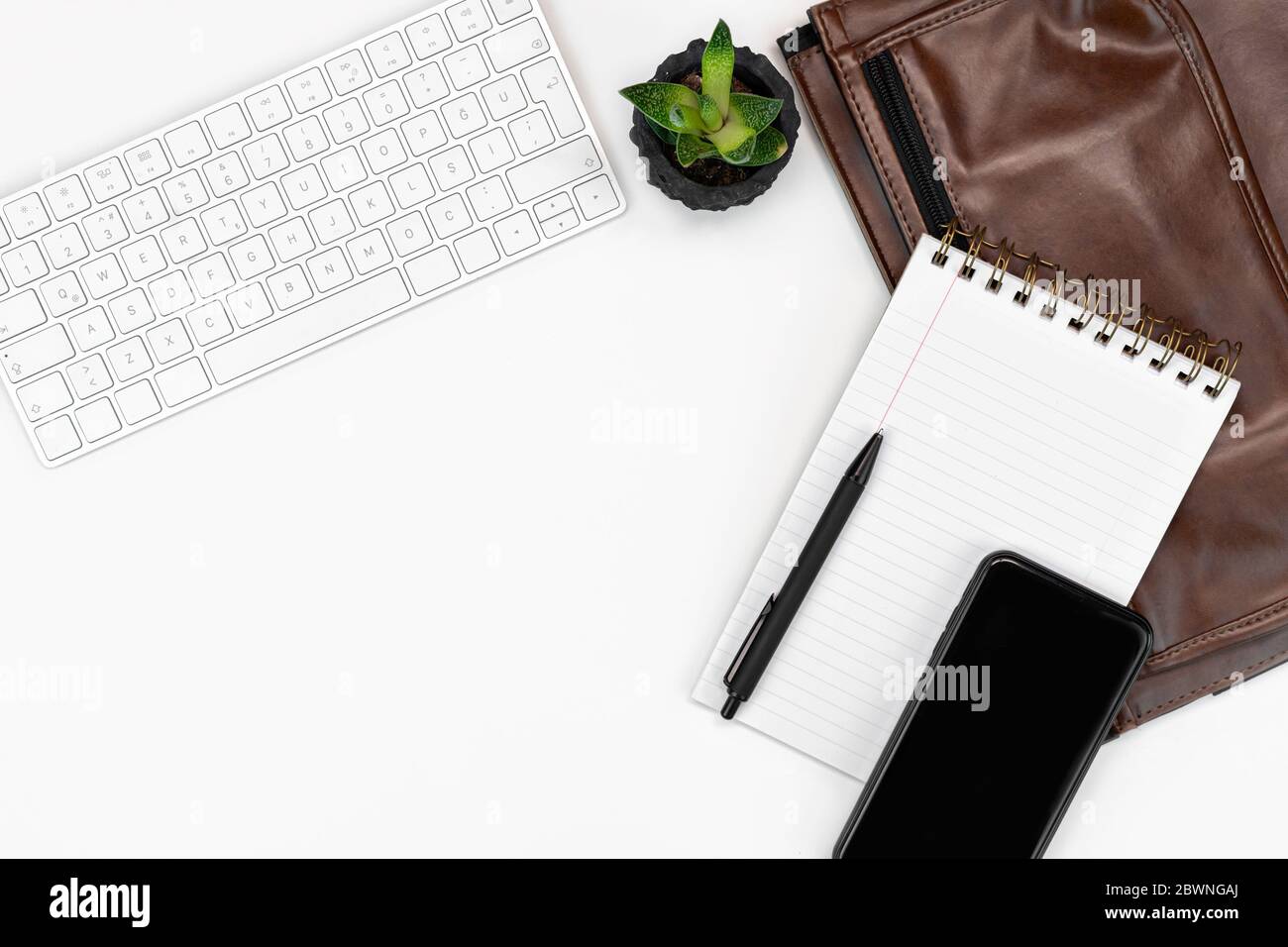 flatlay of White office desk table layout. computer keyboard, glasses ...