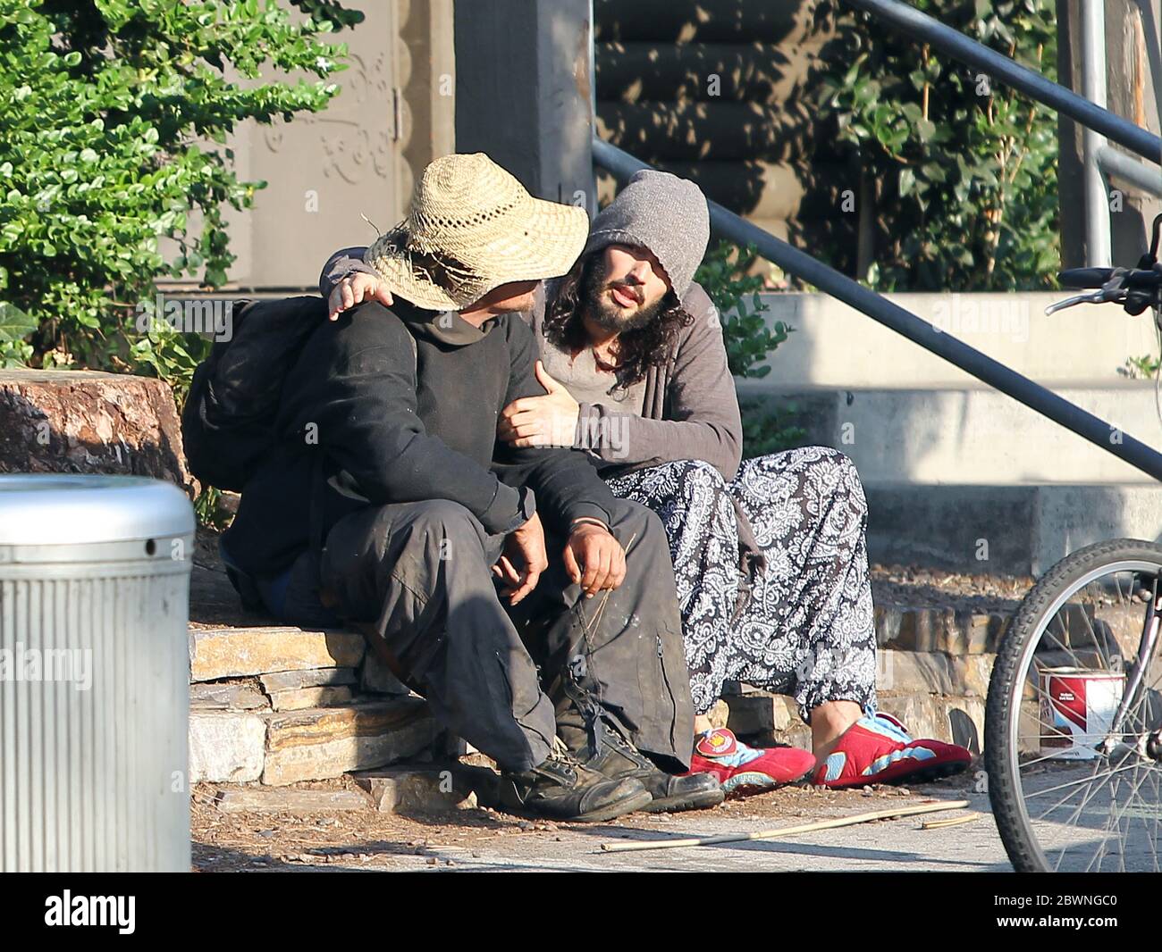 Russell Brand spends some time consoling a homeless man on the streets ...