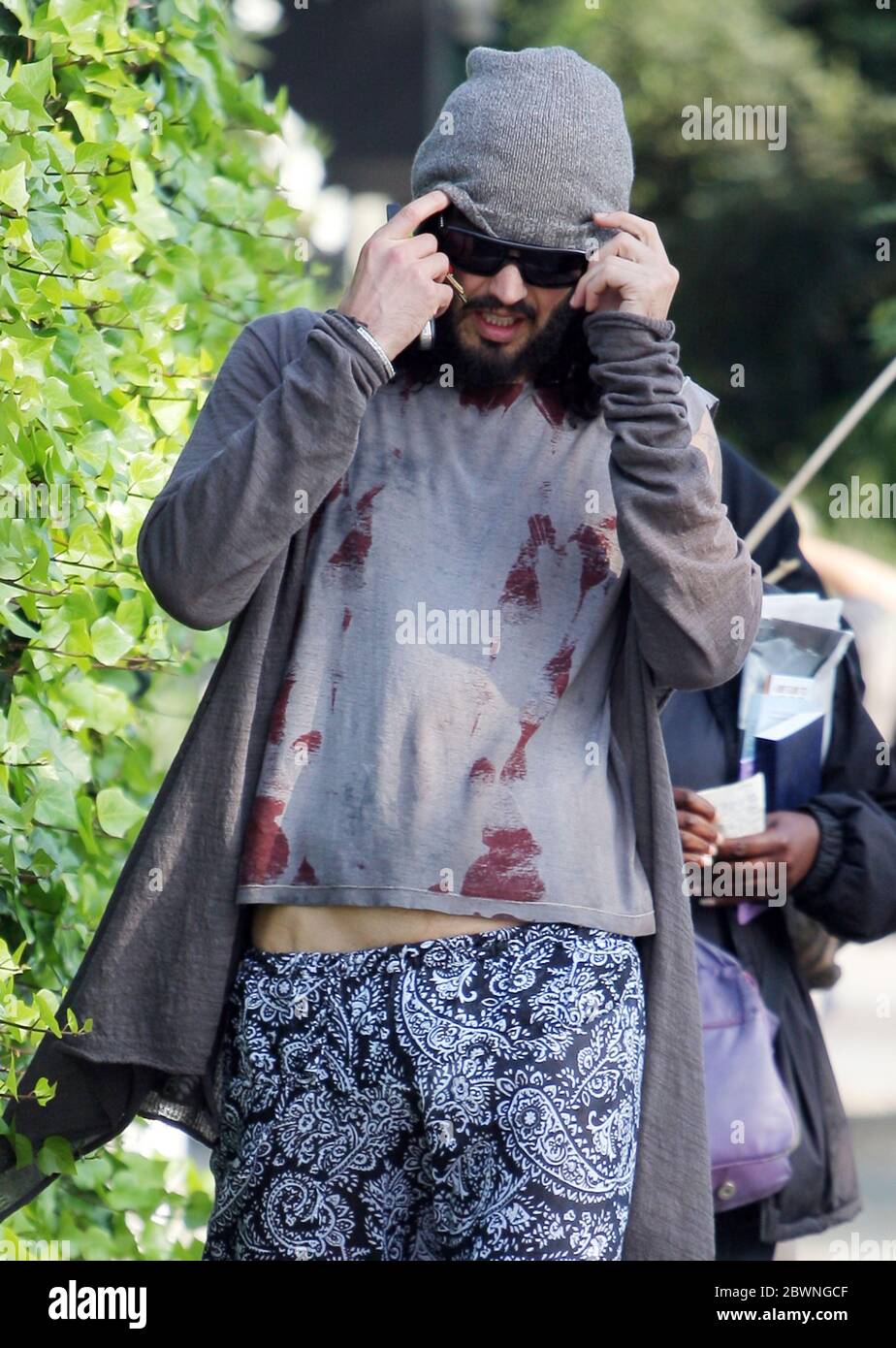 Russell Brand spends some time consoling a homeless man on the streets ...