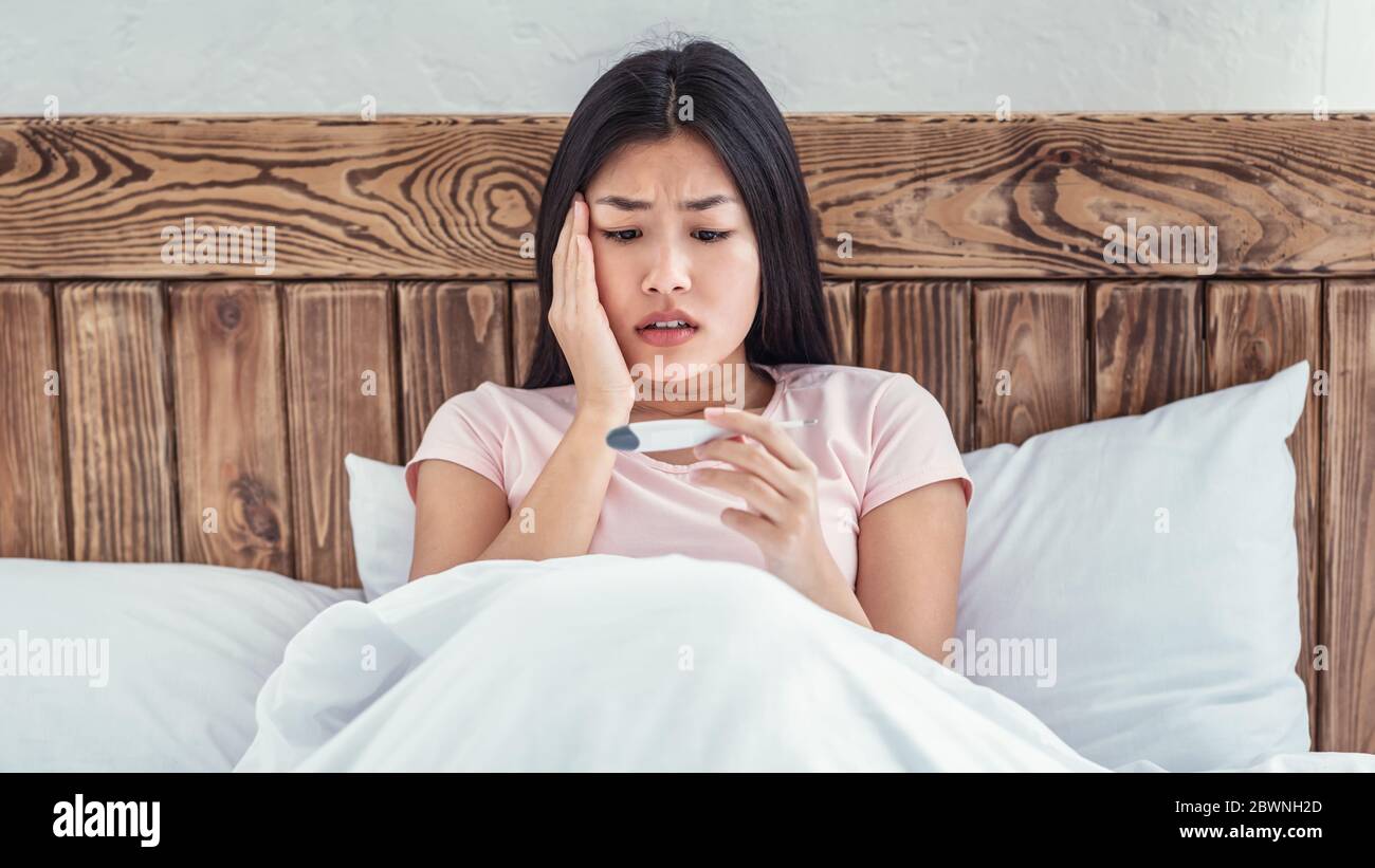 Fever. Sick Japanese Woman Holding Thermometer Having High Temperature ...