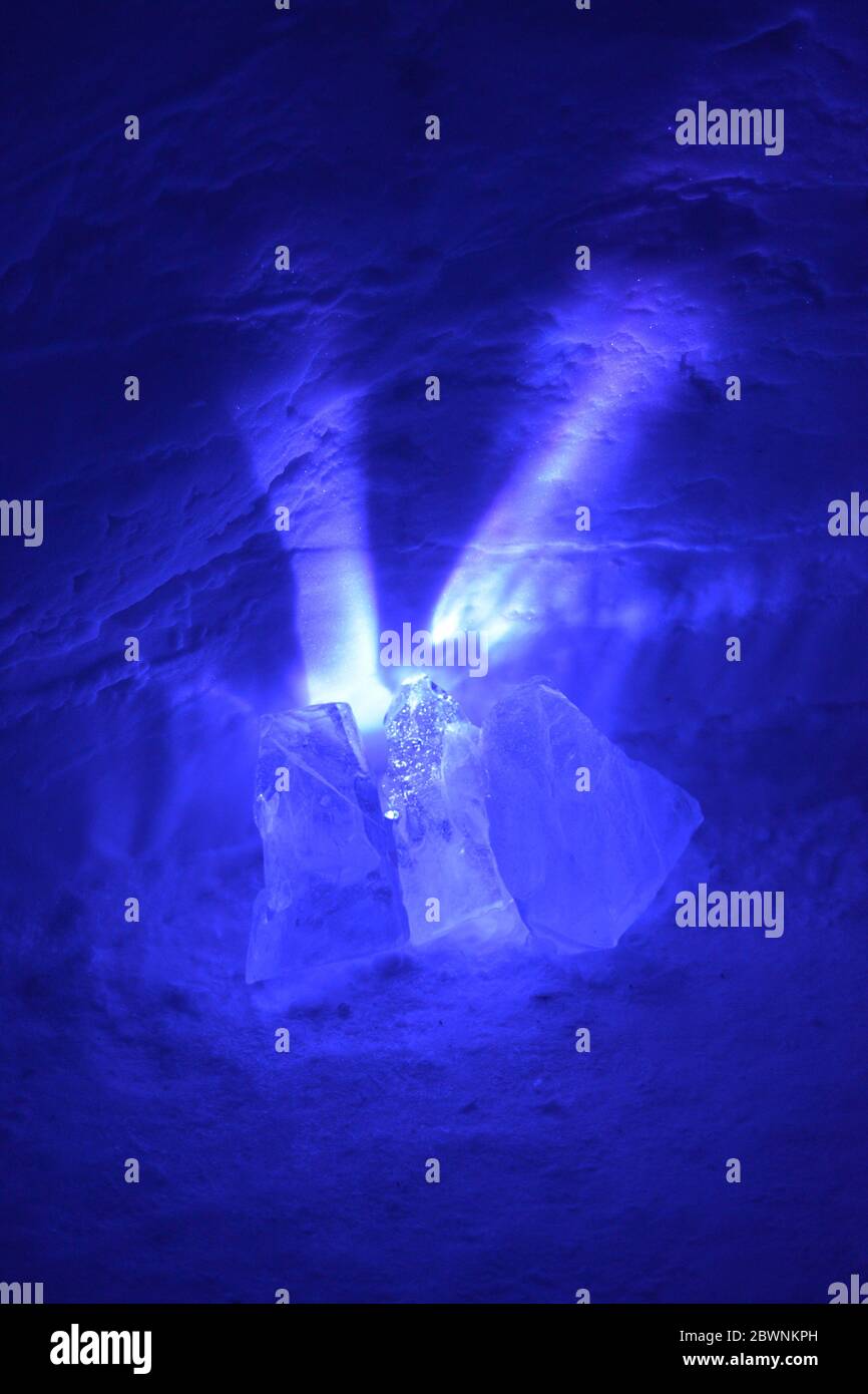 A small light source causes exploding purple rays to spread out from ...