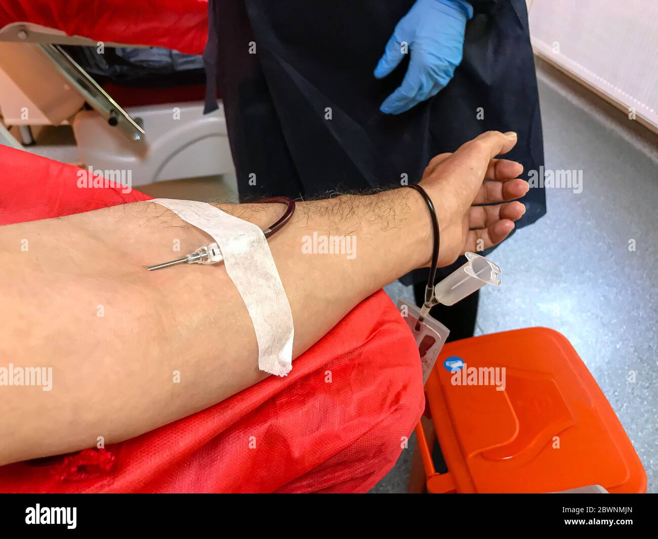 Needle in arm blood donation hi-res stock photography and images - Alamy