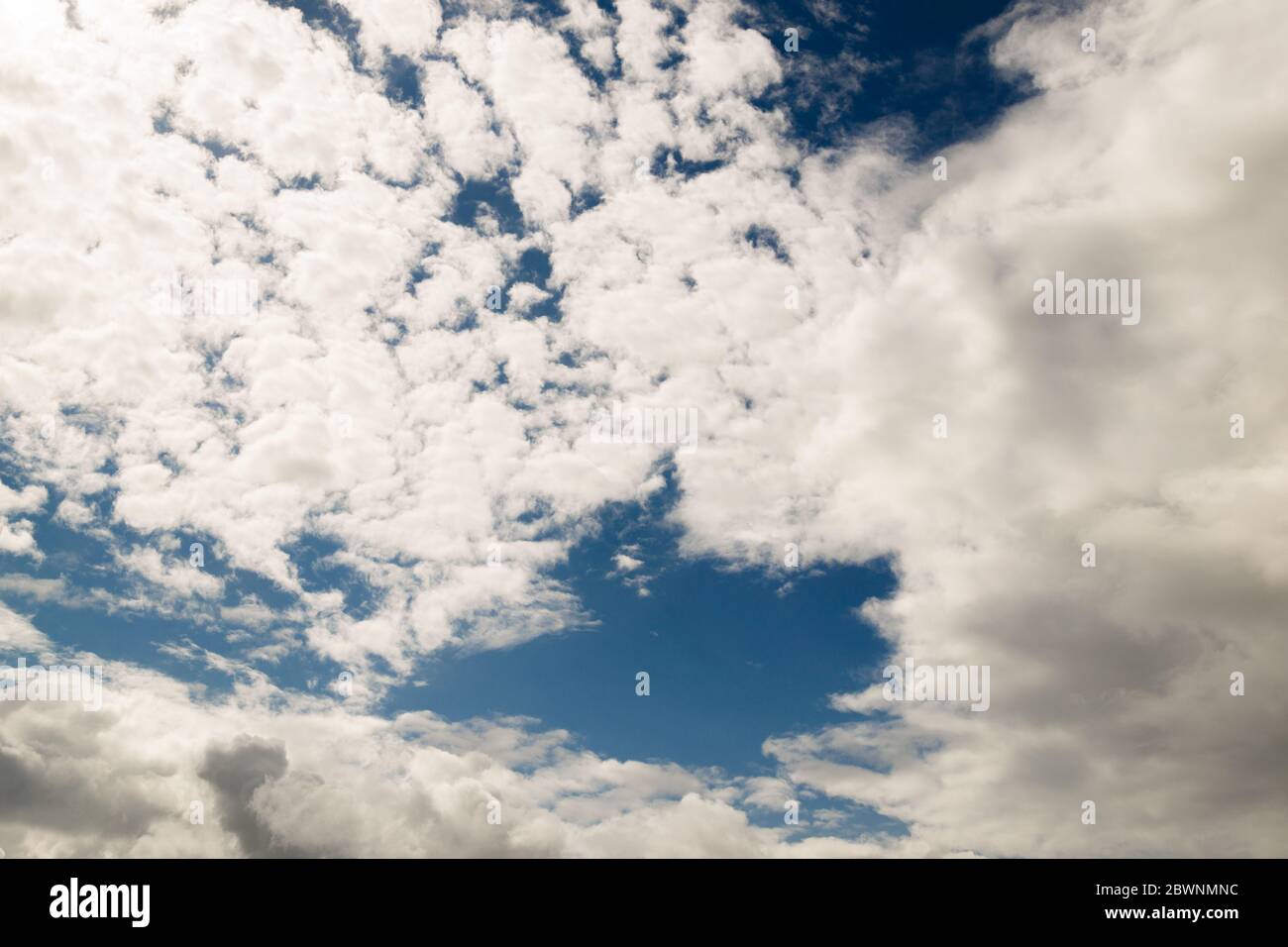 Clouds in the sky contract in landscape format Stock Photo - Alamy