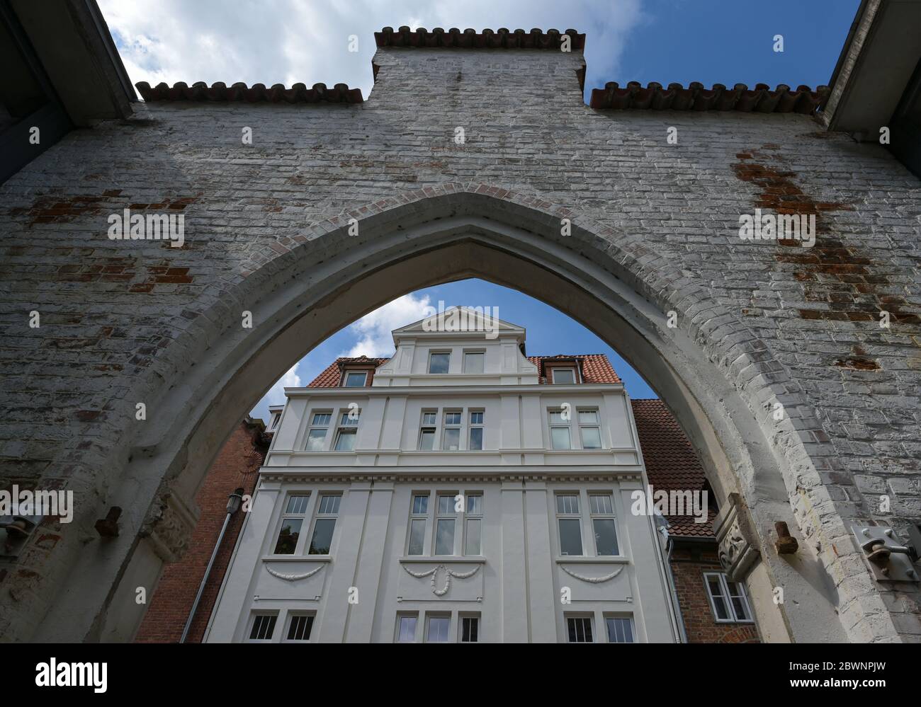 View through an arched gateway to an historic old town house in the ...