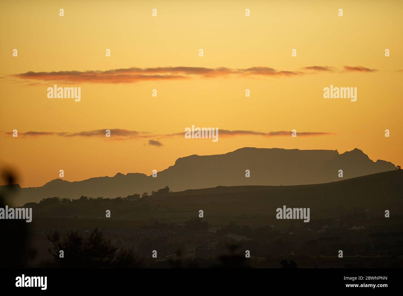 Sunset over Table Mountain and Bottelary Hills Stock Photo - Alamy