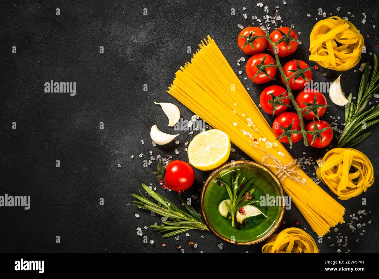 Food cooking background at black table top view Stock Photo - Alamy