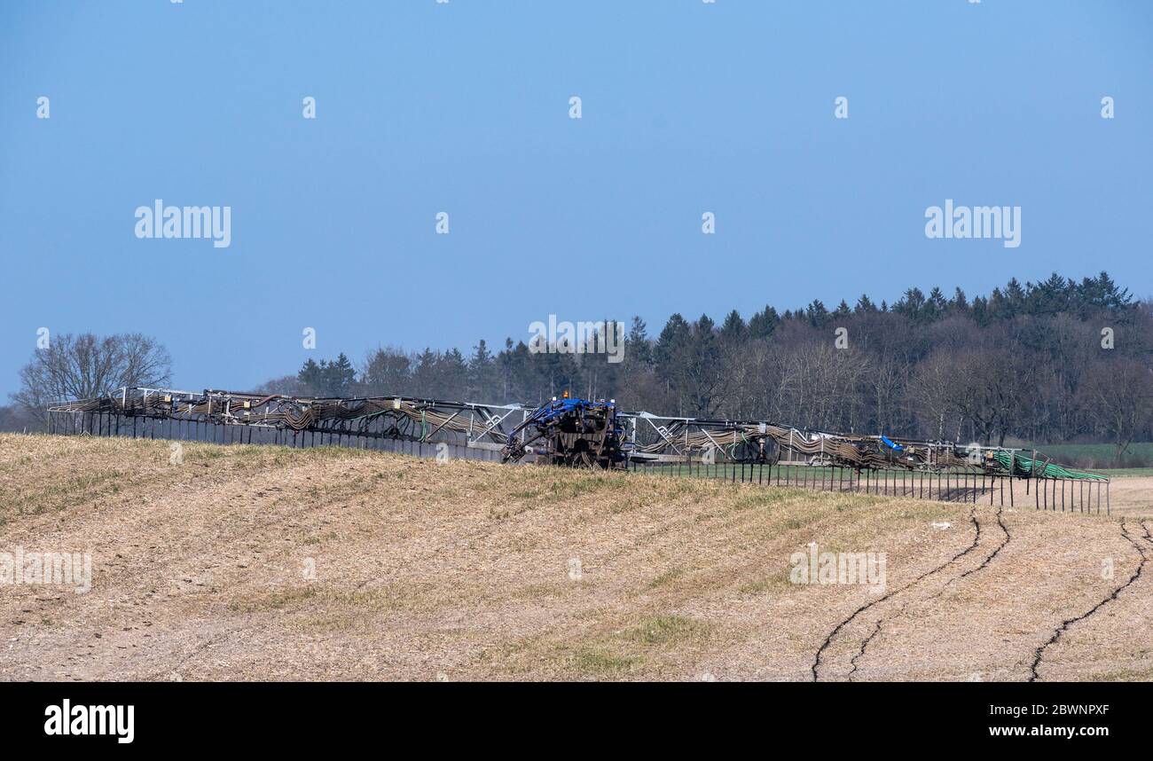 Slurry hosing, agricultural vehicle is distributing liquid manure ...