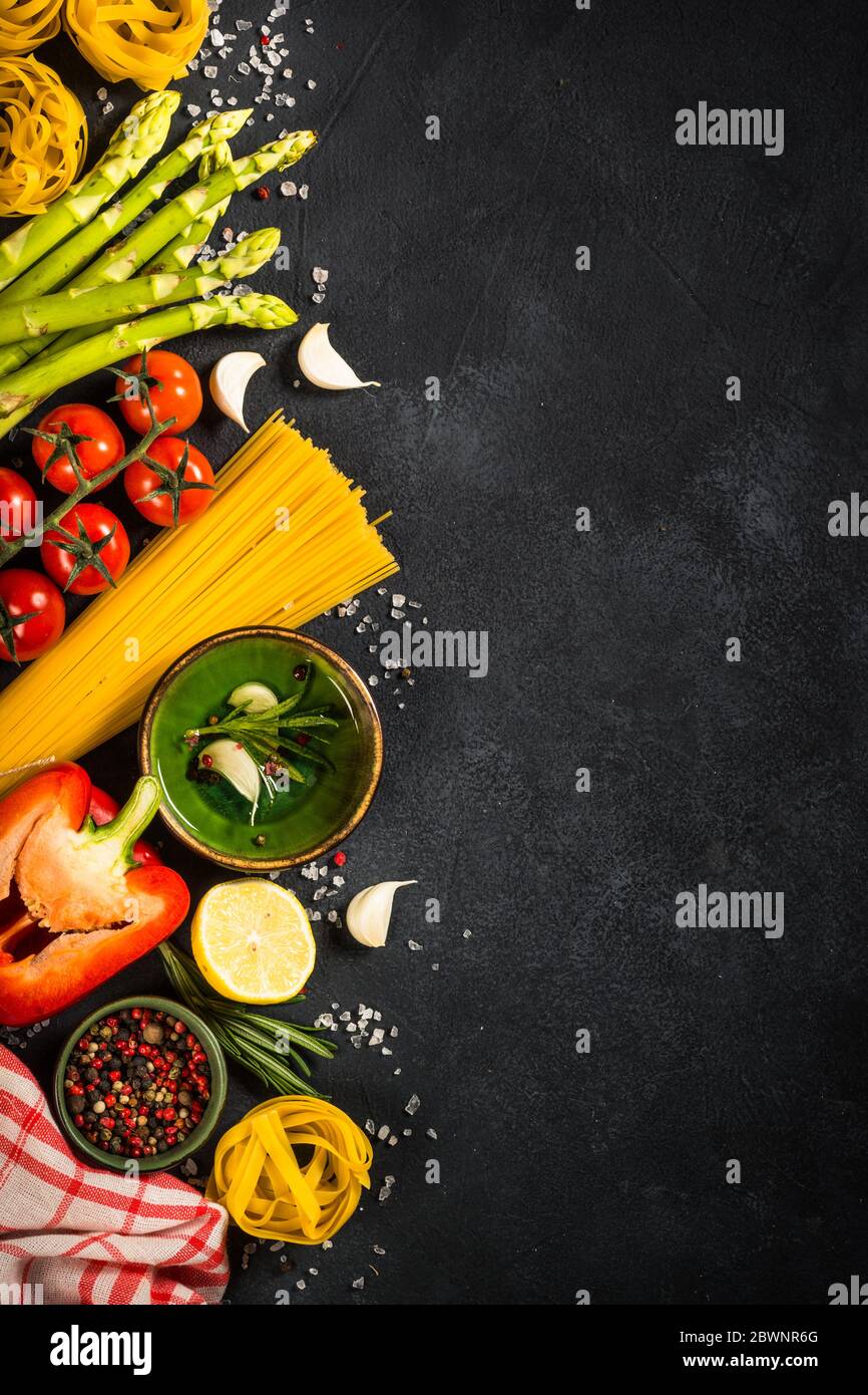 Food cooking background at black table top view Stock Photo - Alamy