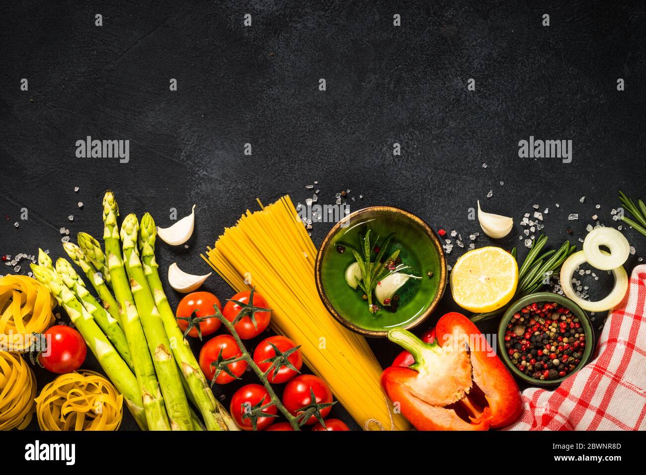 Food cooking background at black table top view Stock Photo - Alamy