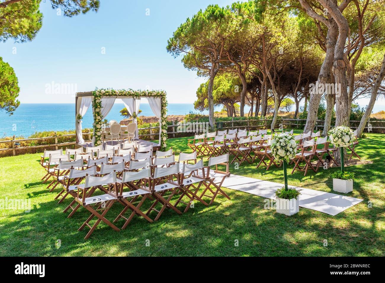 Beautiful wedding by the ocean on a sunny day. Arch cleaned with ...