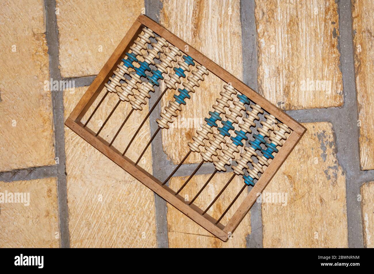 Old abacus on a stone wall.Decor Object Stock Photo - Alamy