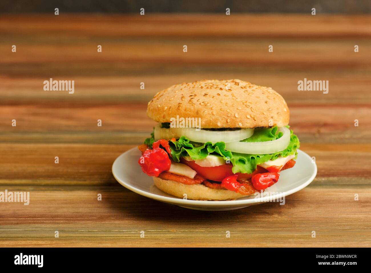 Preparation of delicious burger in a restaurant. Delicious burger on ...