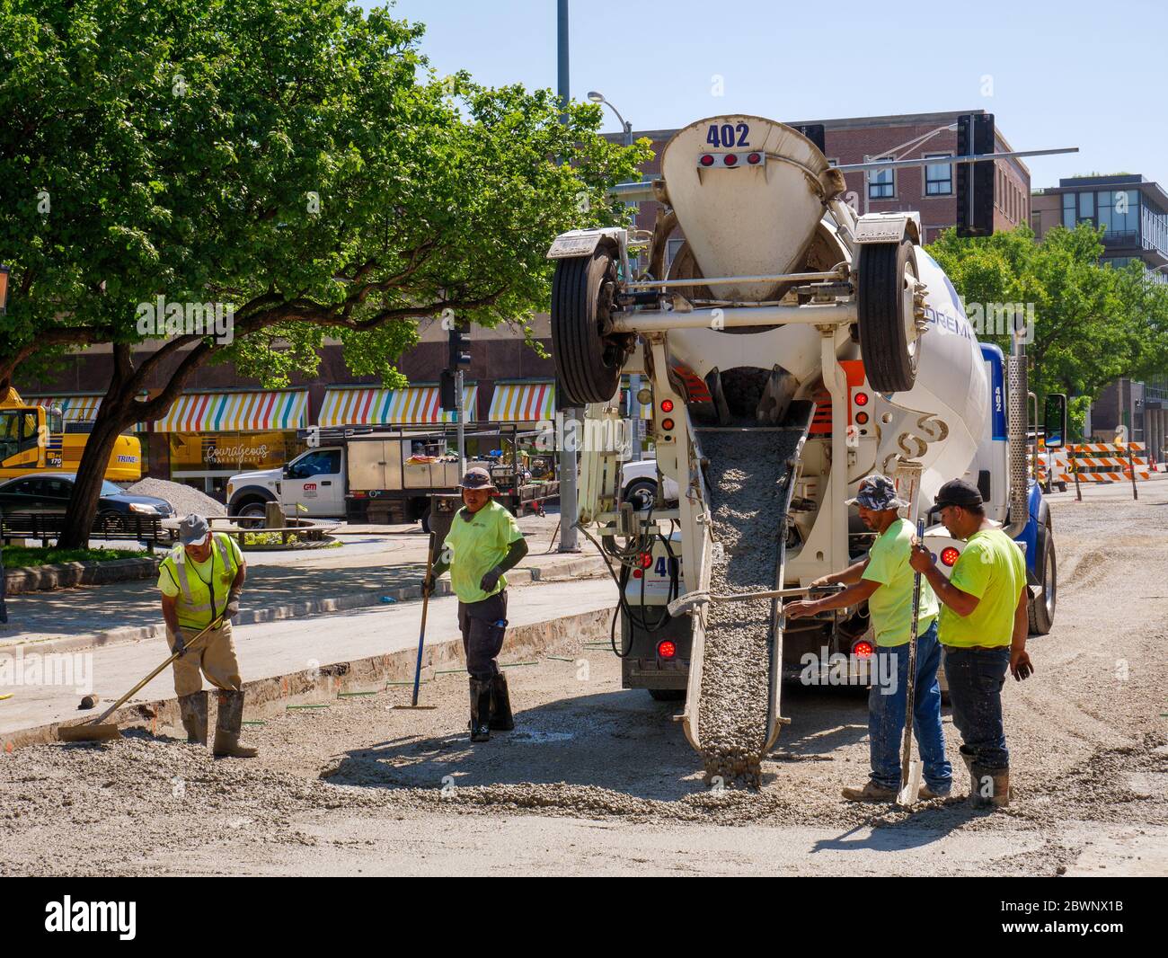 Oak Park, Illinois, USA. 2nd June 2020. Road construction workers pour ...