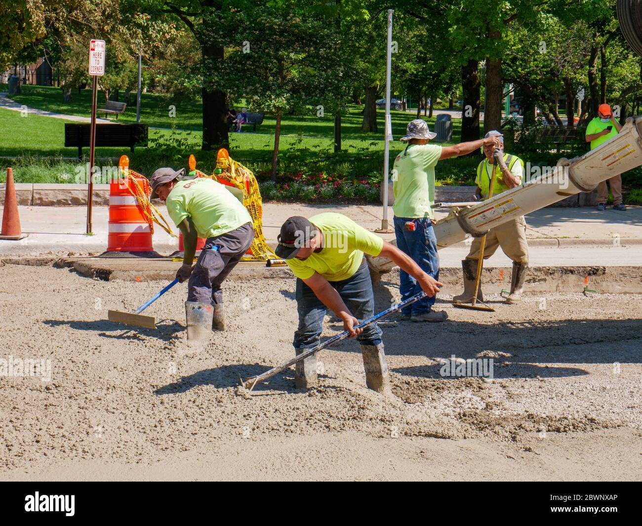 Oak Park, Illinois, USA. 2nd June 2020. Road construction workers pour ...