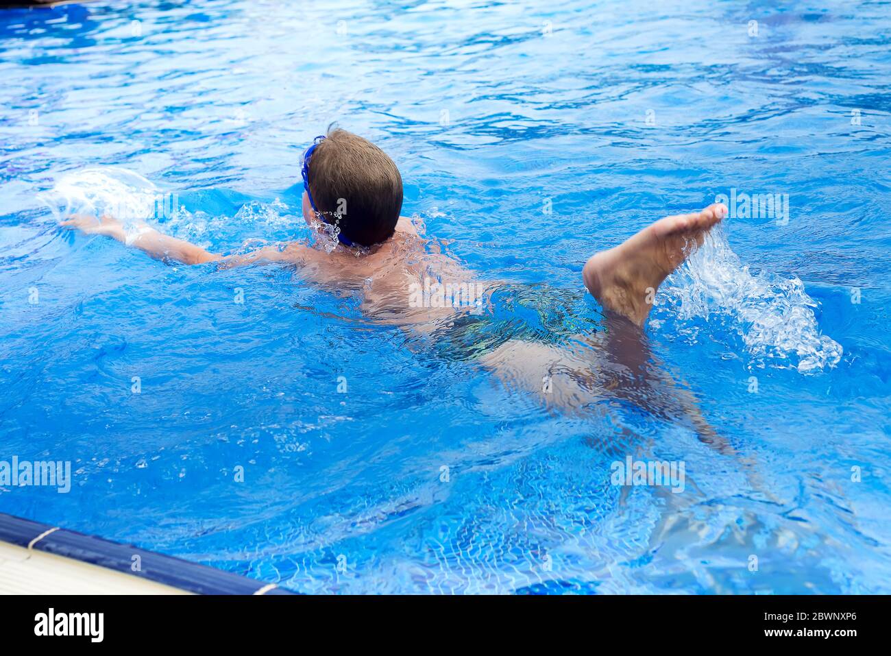 In swimming trunks hi-res stock photography and images - Alamy
