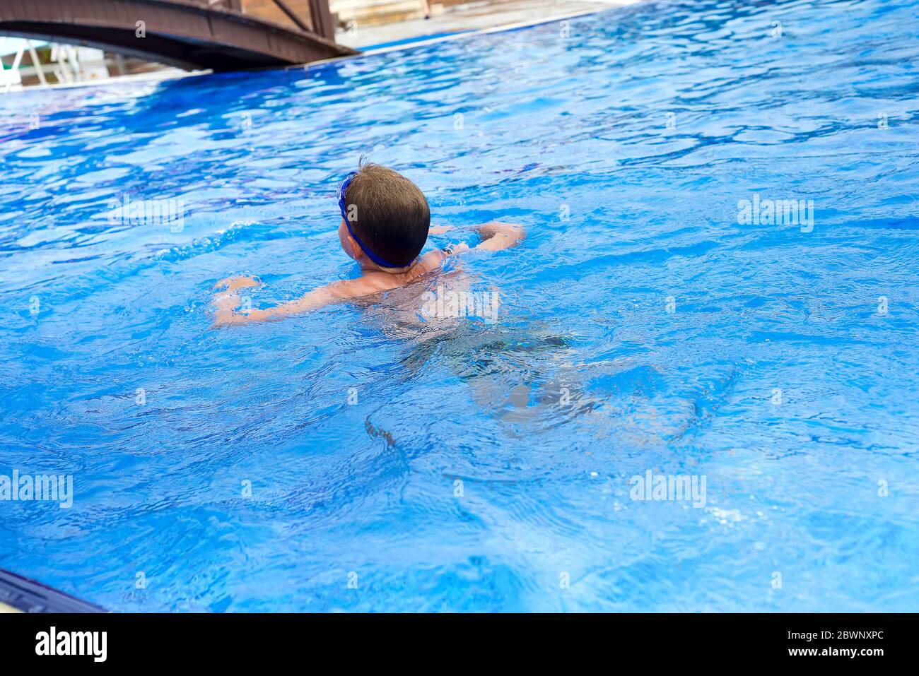 In swimming trunks hi-res stock photography and images - Alamy
