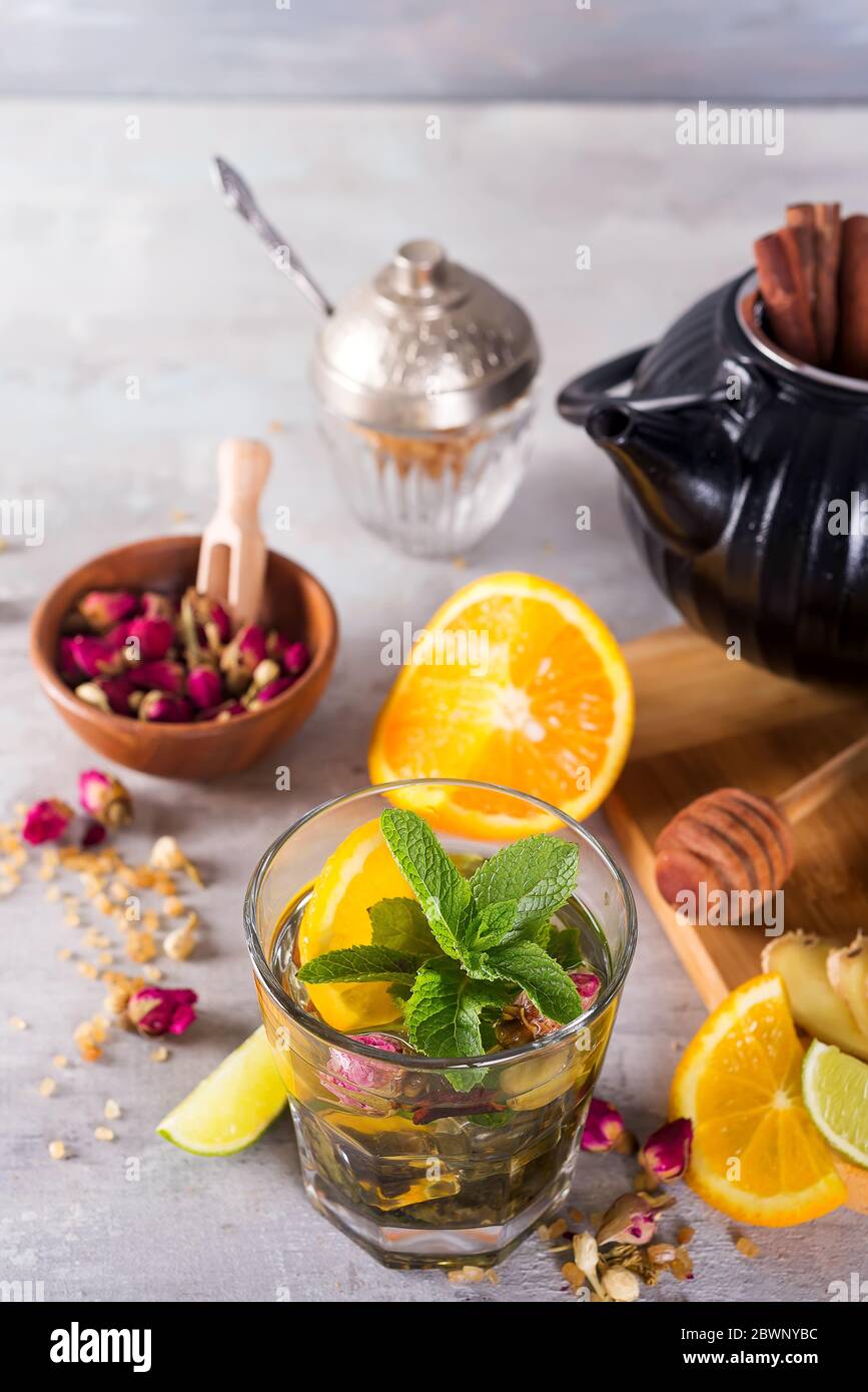 Lemon mint iced tea cocktail refreshing drink beverage in a glass on a ...