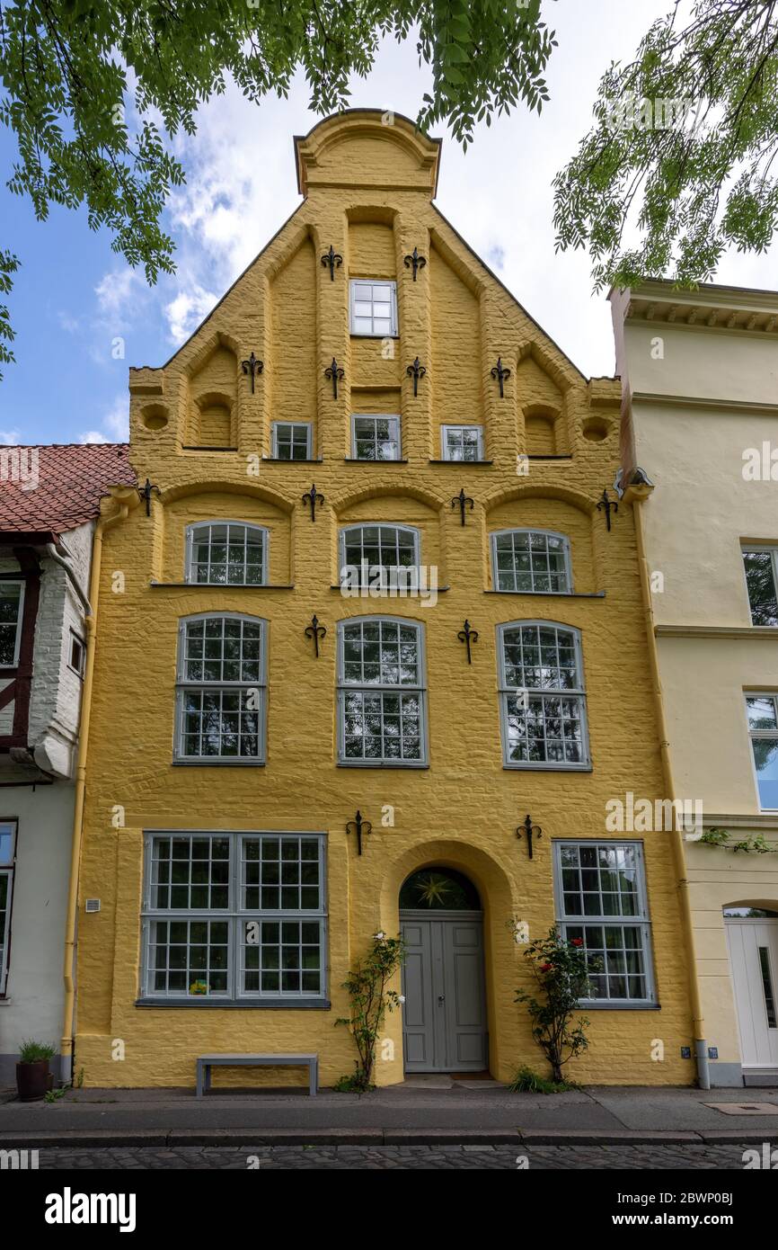 Yellow facade of an historic old town house in the centre of the ...