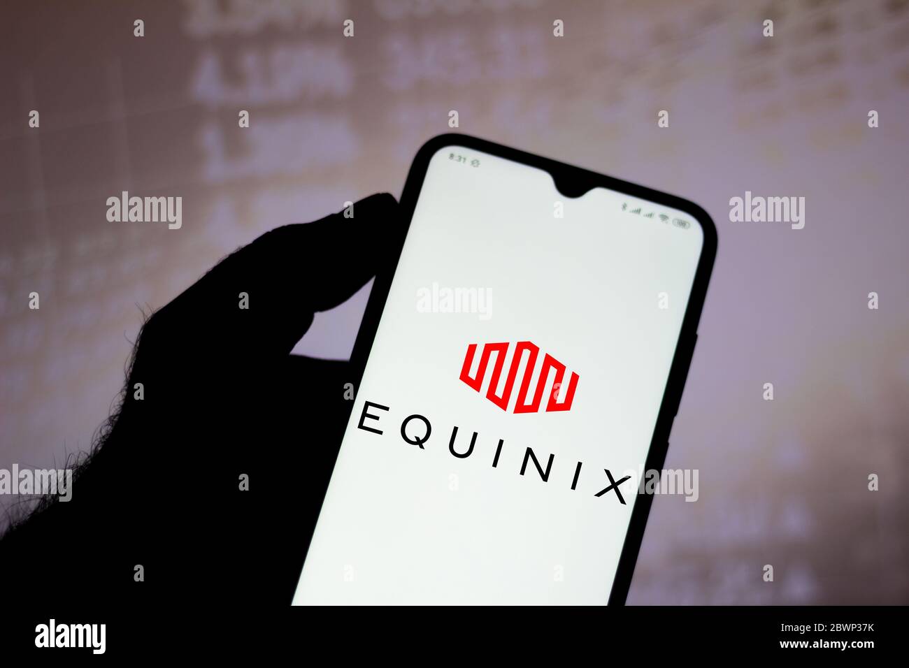 In this photo illustration the Equinix logo seen displayed on a ...