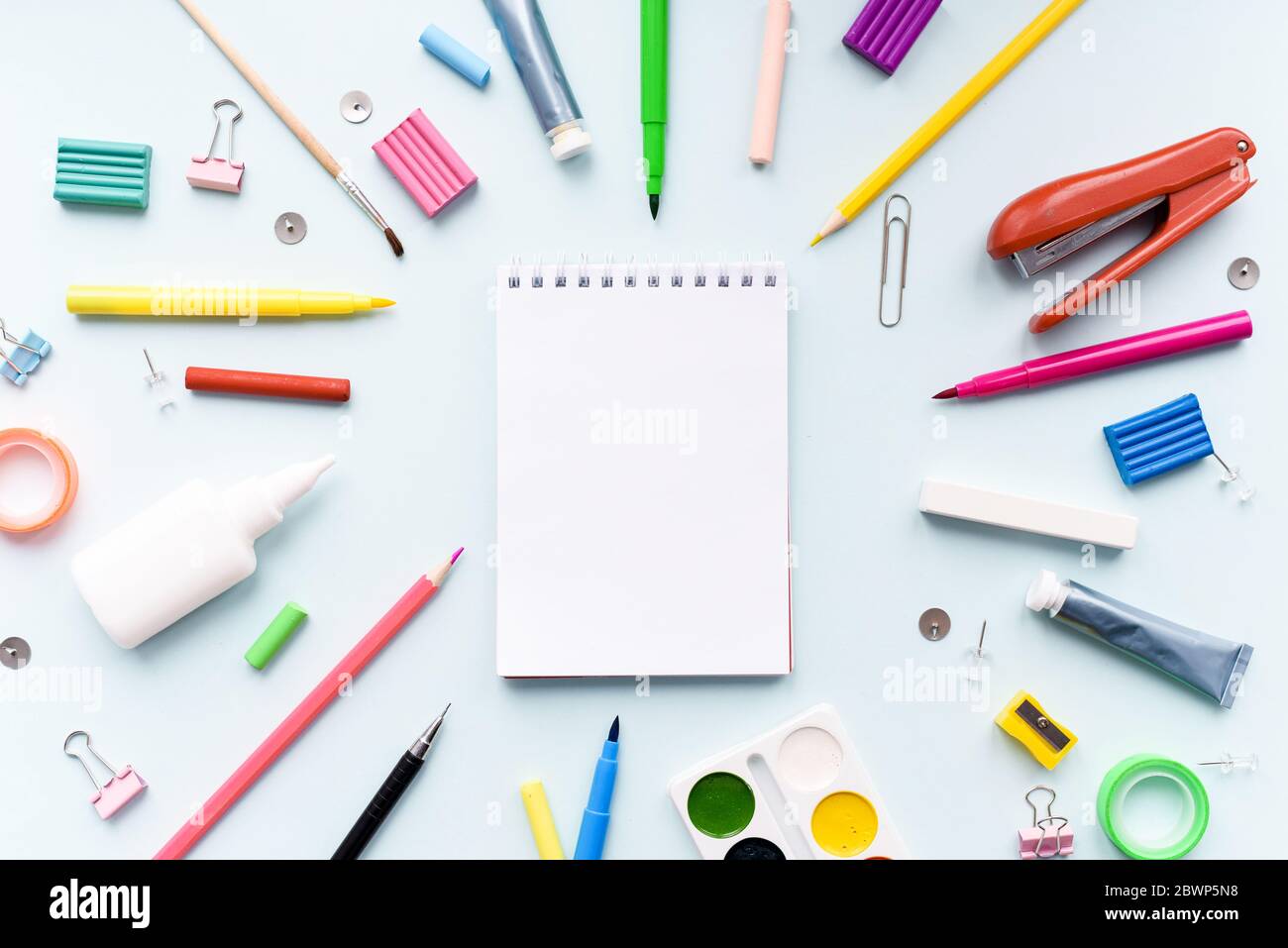 Notebook with stationary objects in the blue background. Back to school ...