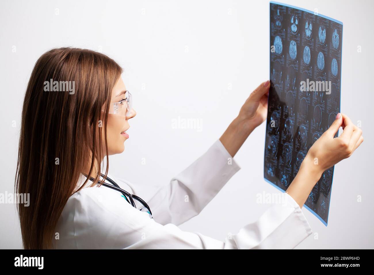 A young doctor examines an MRI image of a patient Stock Photo - Alamy