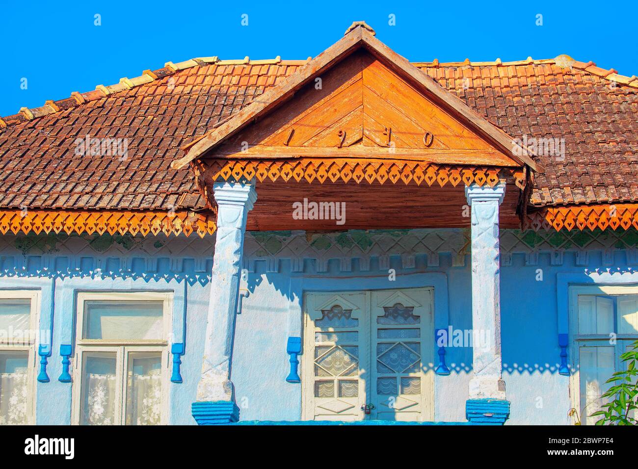 old house with a veranda covered by red tiles Stock Photo - Alamy