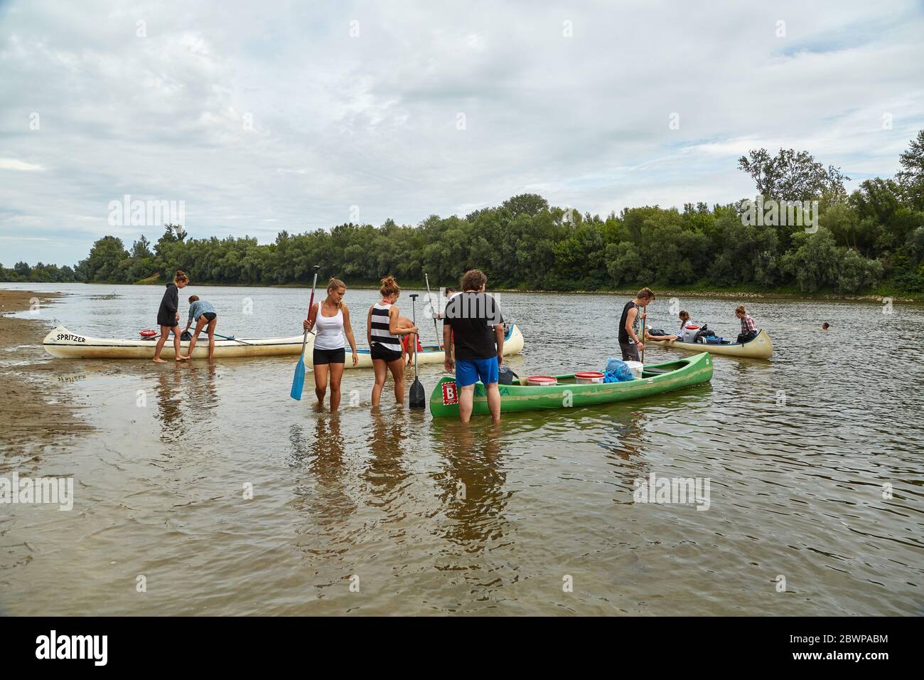 Canoes on the Riverside, People preparing for a trip Stock Photo - Alamy