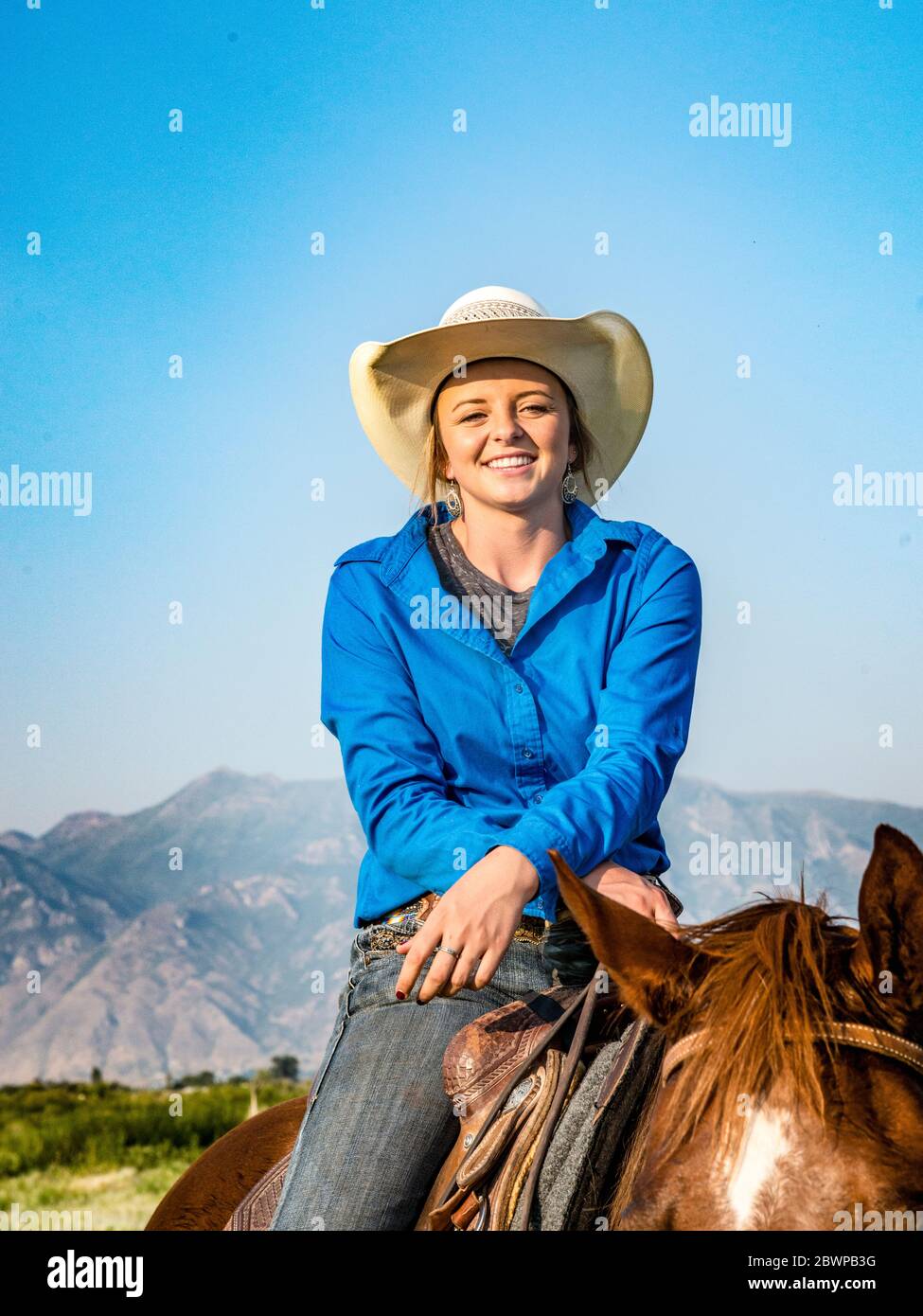 Cowgirl on Horseback on Ranch Stock Photo - Alamy