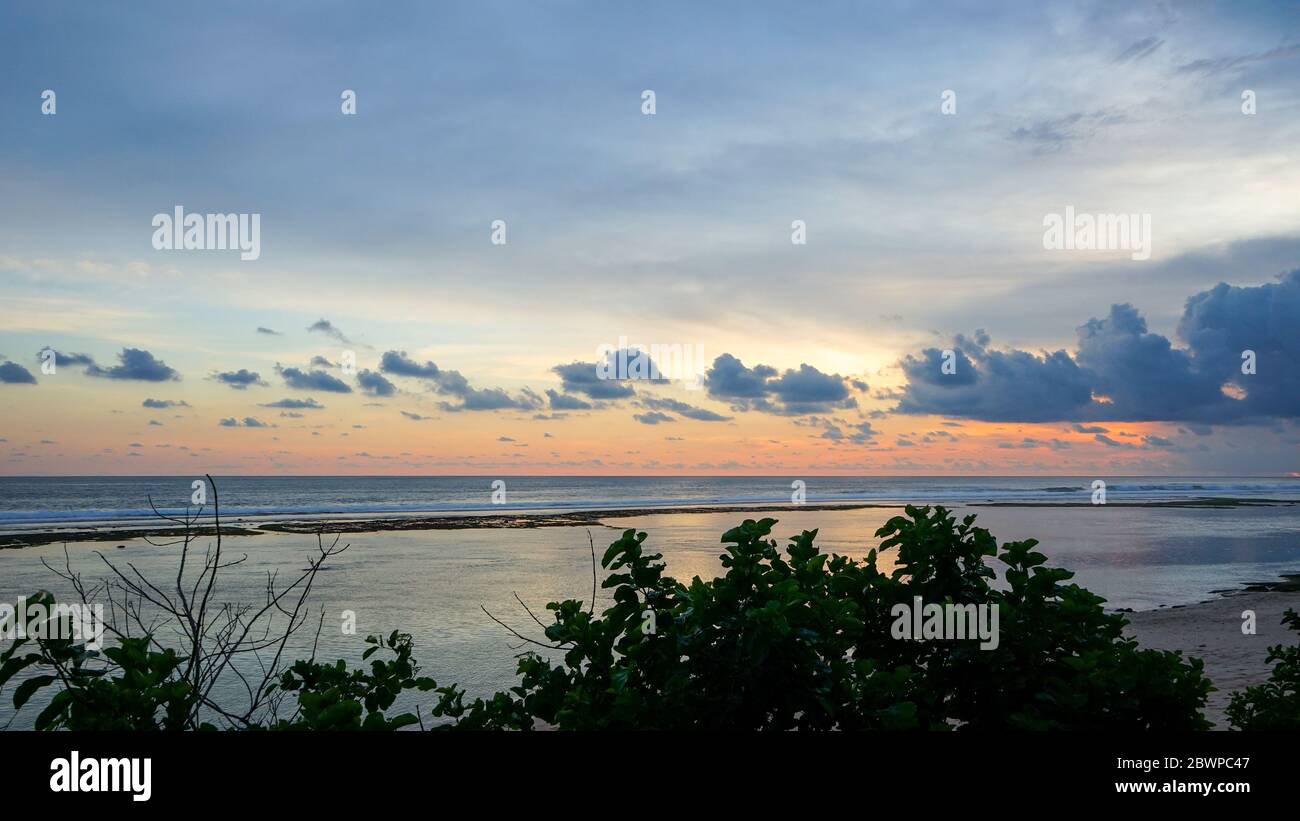 Beautiful views of the beach, trees and sunset sky from the top of the ...