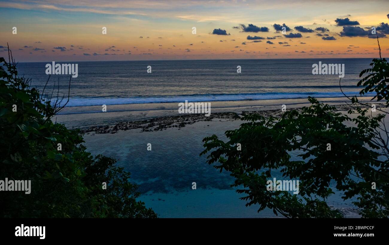 Beautiful views of the beach, trees and sunset sky from the top of the ...