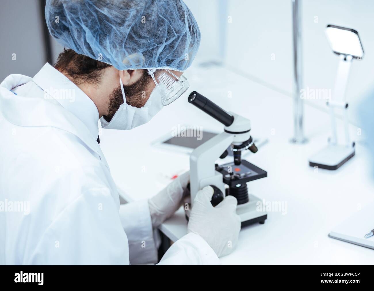 close up. scientist using a microscope in the laboratory Stock Photo ...