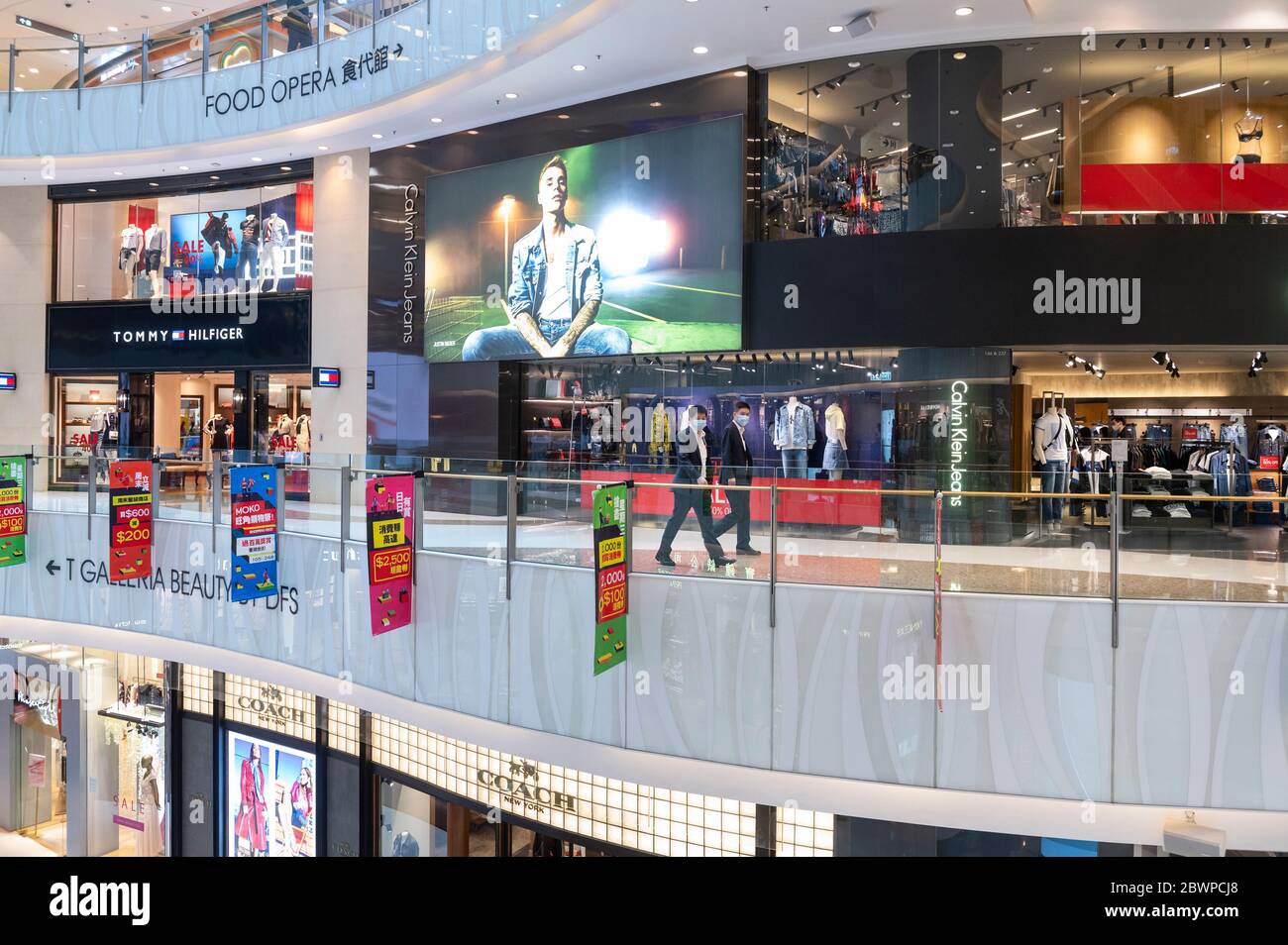 Two men wearing face masks are seen walking at a shopping mall in Hong ...