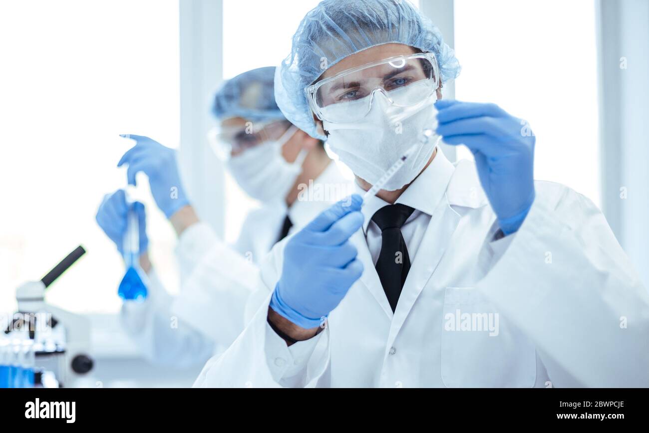 background image of a laboratory assistant in a medical laboratory ...