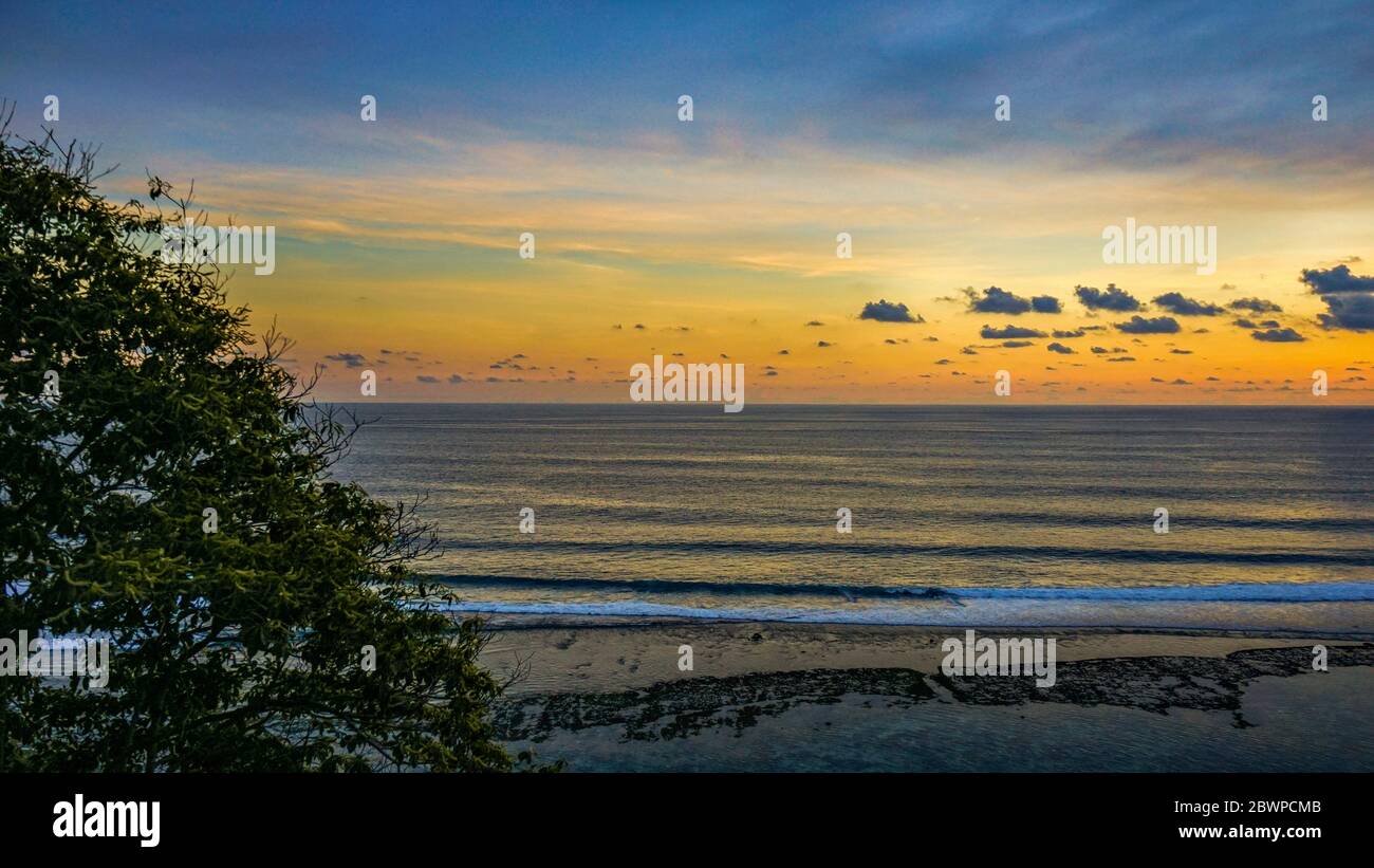 Beautiful views of the beach, trees and sunset sky from the top of the ...