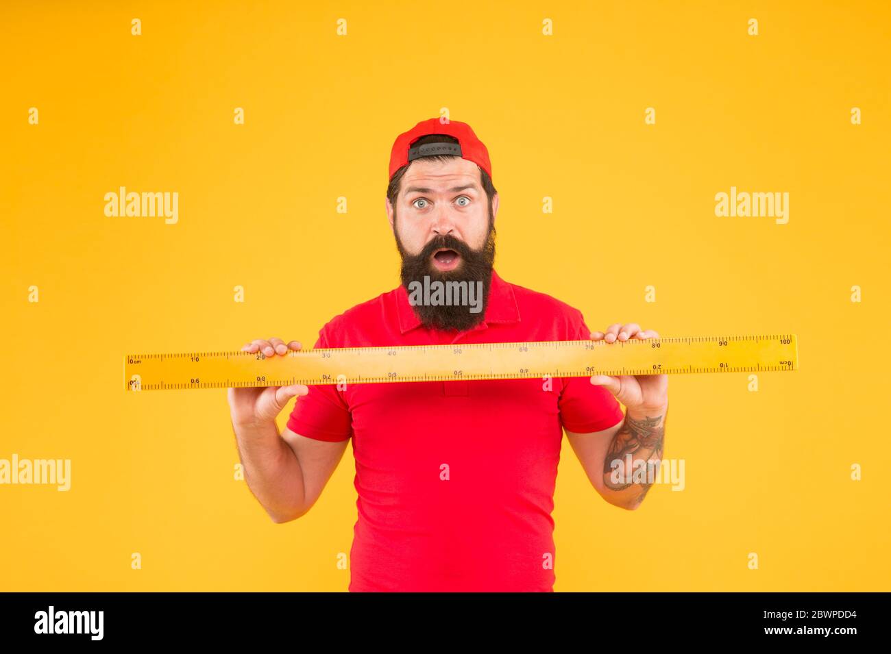 Without geometry life is pointless. Surprised hipster hold ruler yellow ...