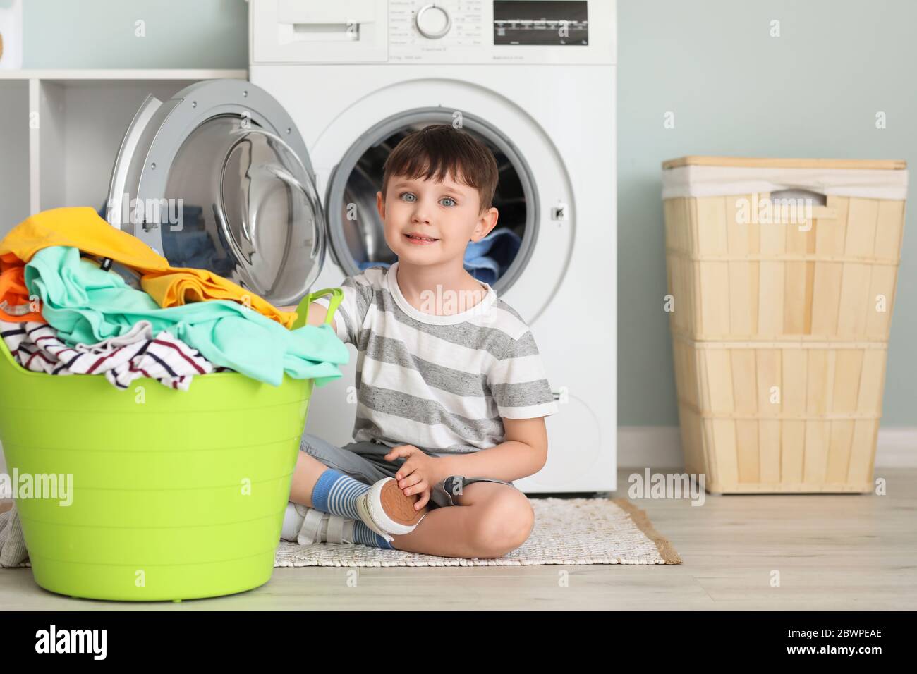 Little boy with dirty clothes at home Stock Photo - Alamy