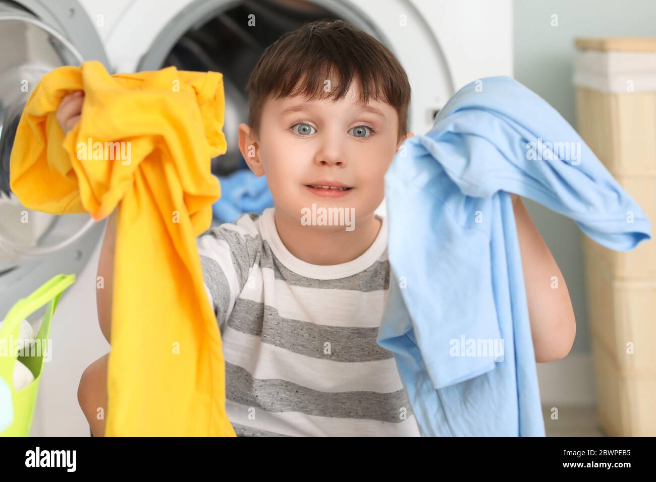 Little boy with dirty clothes at home Stock Photo - Alamy