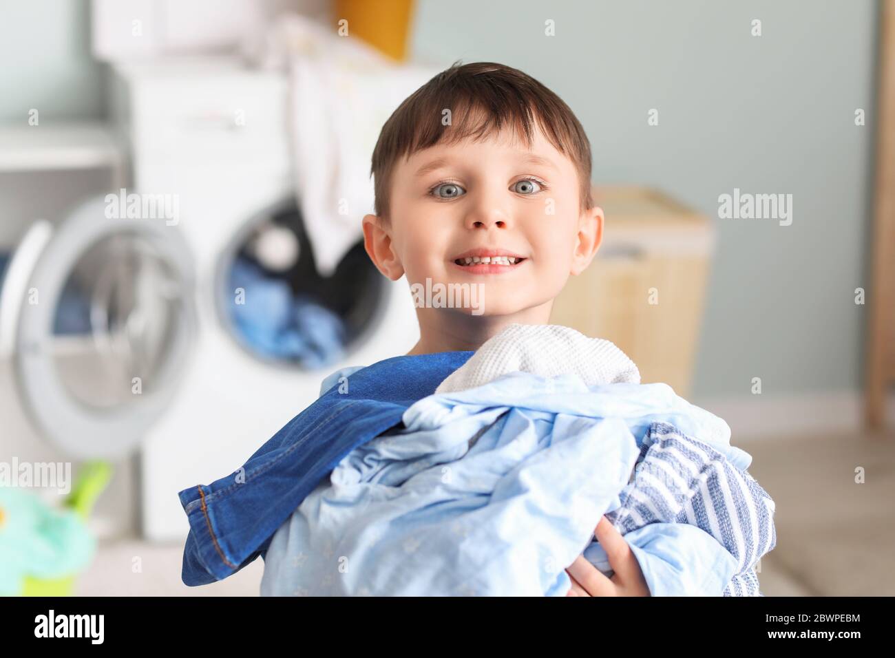 Little boy with dirty clothes at home Stock Photo - Alamy